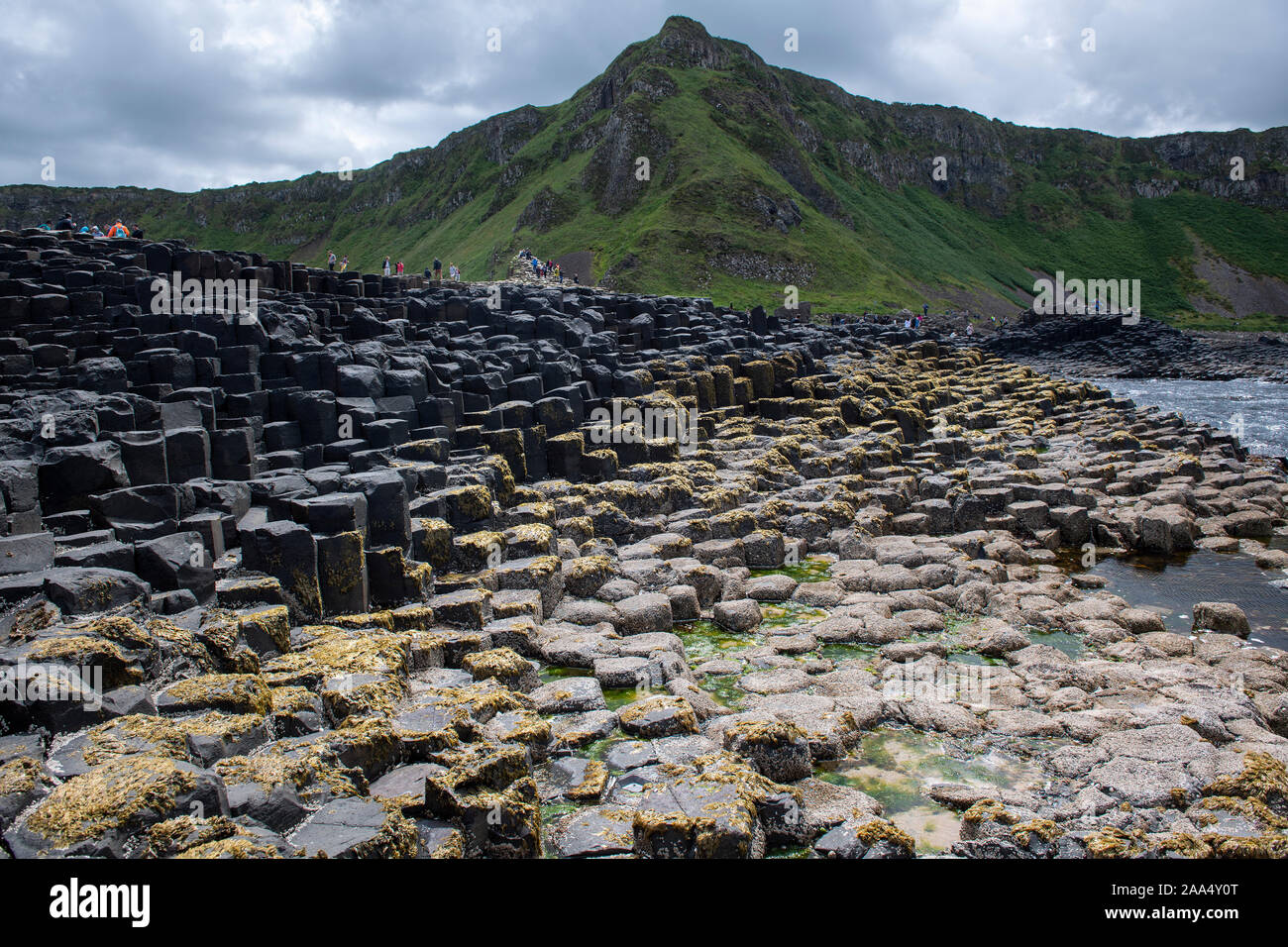 People visiting the Giants Causeway in County Antrim, Northern Ireland ...