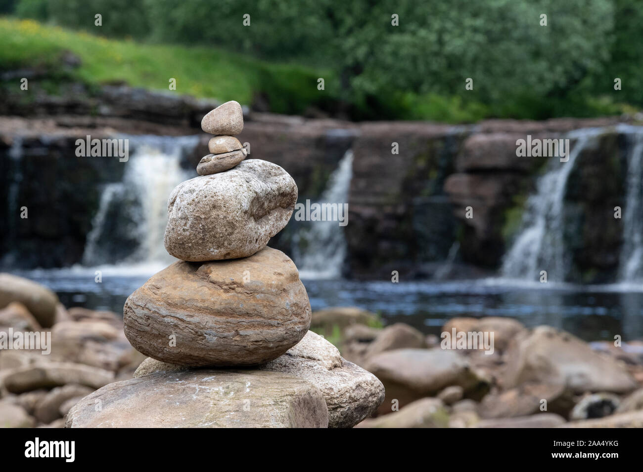 Stone stacking at Wainwath Falls in the Yorkshire Dales National Park ...