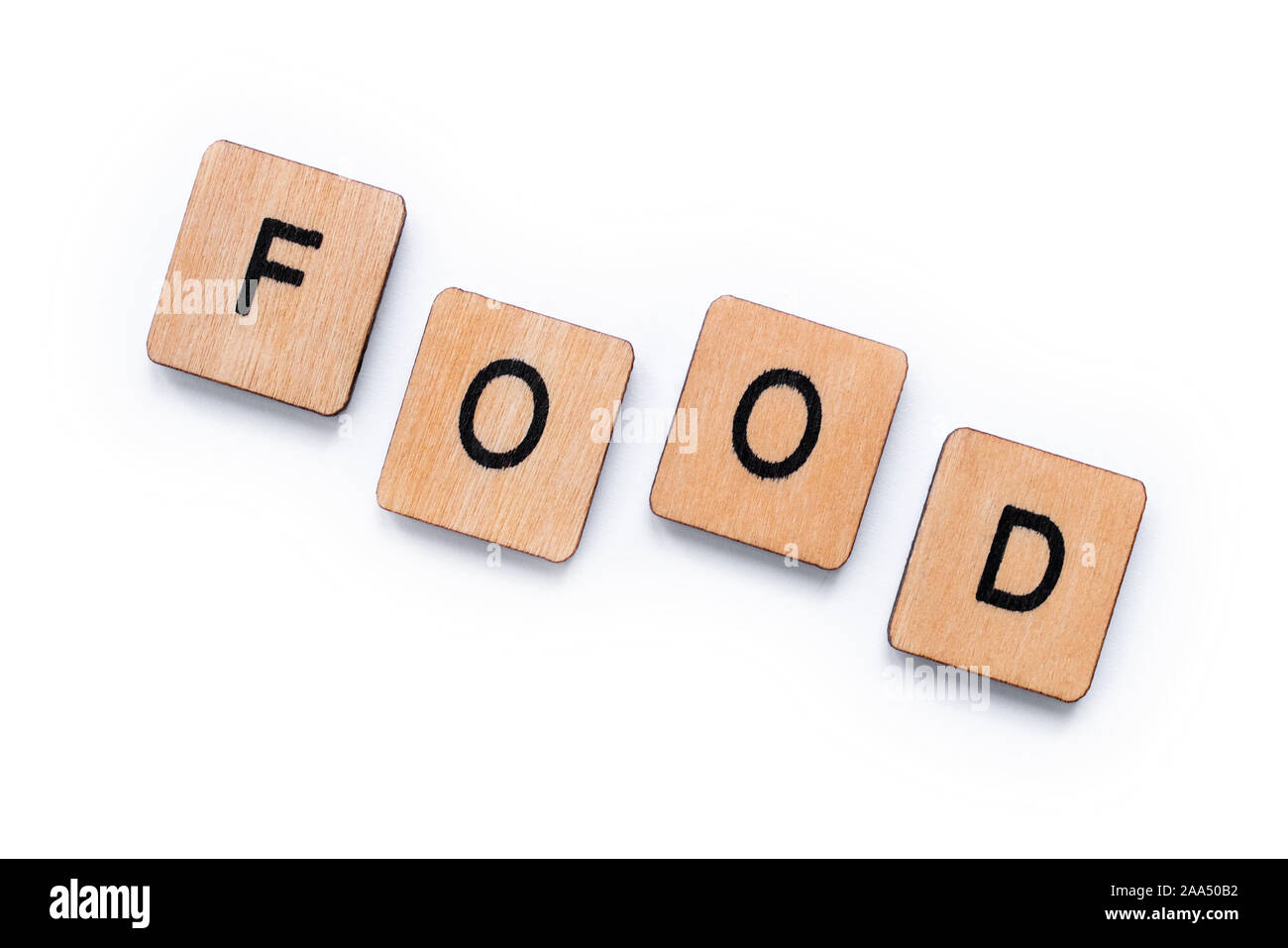 The word FOOD, spelt with wooden letter tiles over a white background ...