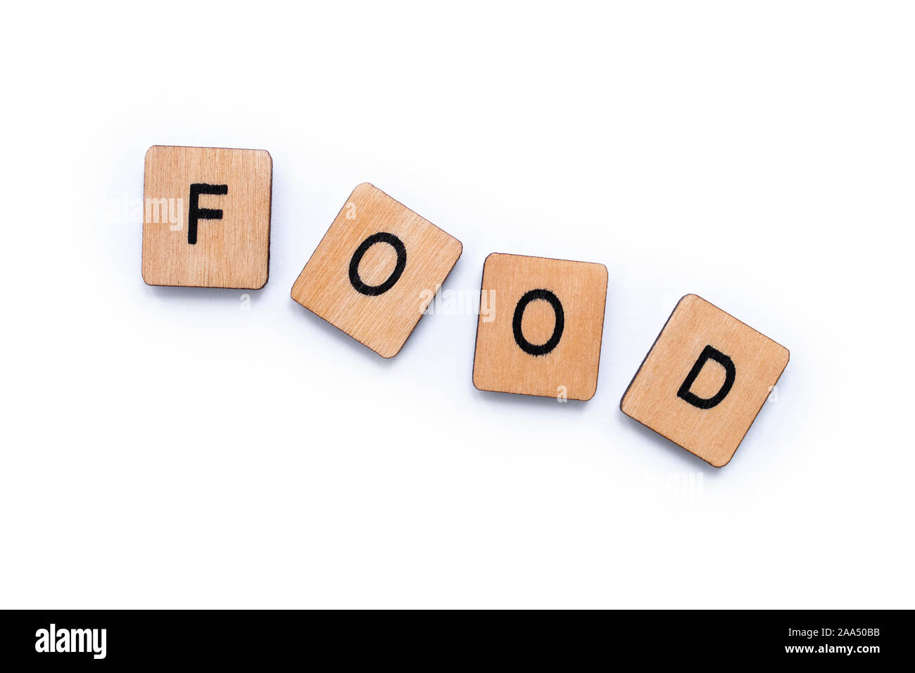 The word FOOD, spelt with wooden letter tiles over a white background ...
