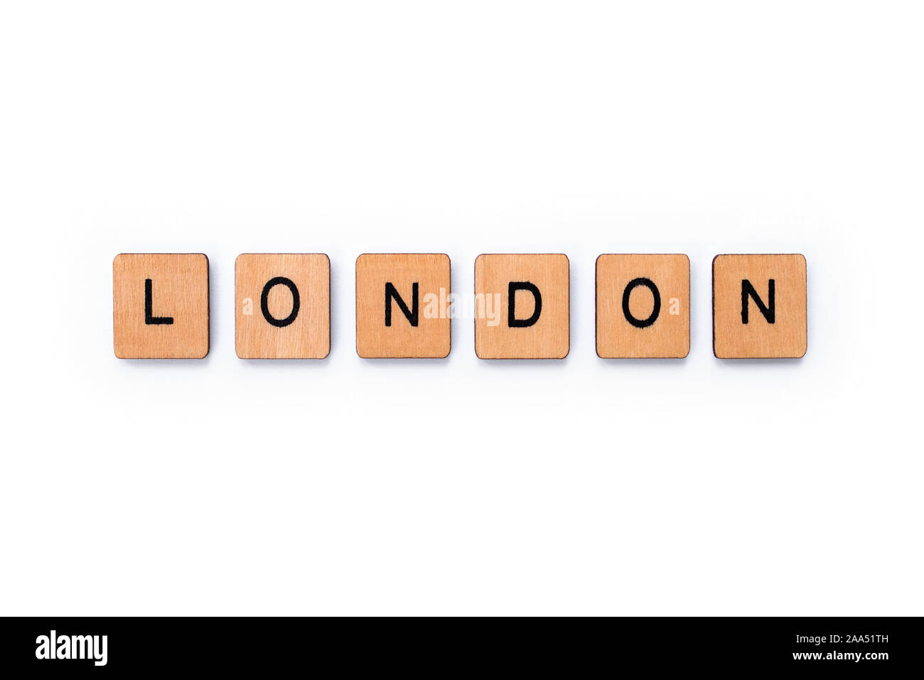 The word LONDON, spelt with wooden letter tiles over a white background ...