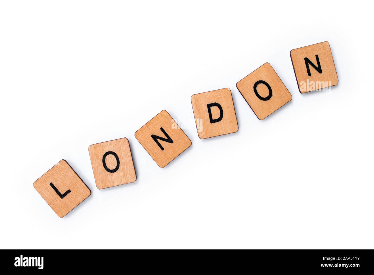 The word LONDON, spelt with wooden letter tiles over a white background ...