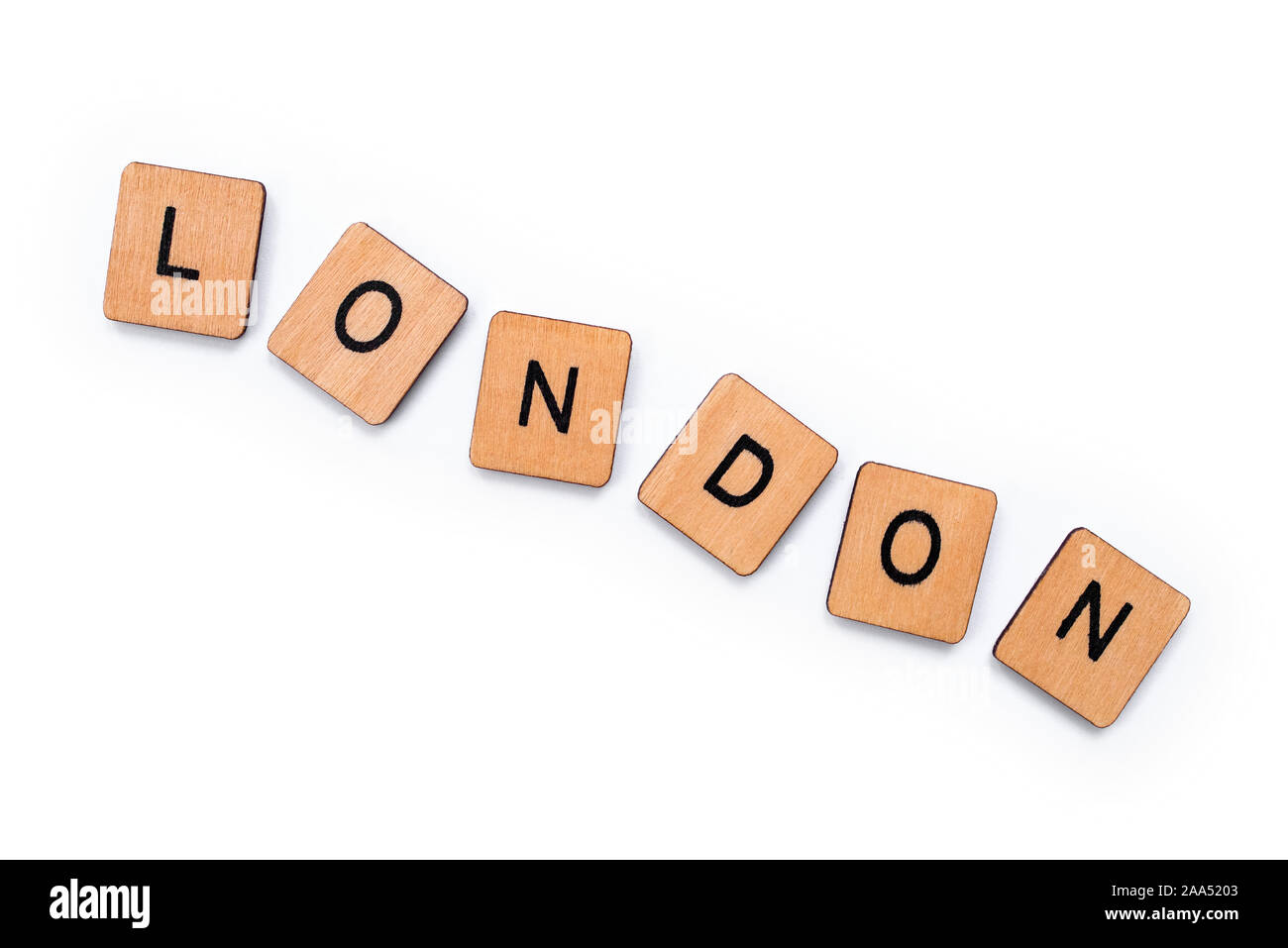 The word LONDON, spelt with wooden letter tiles over a white background ...