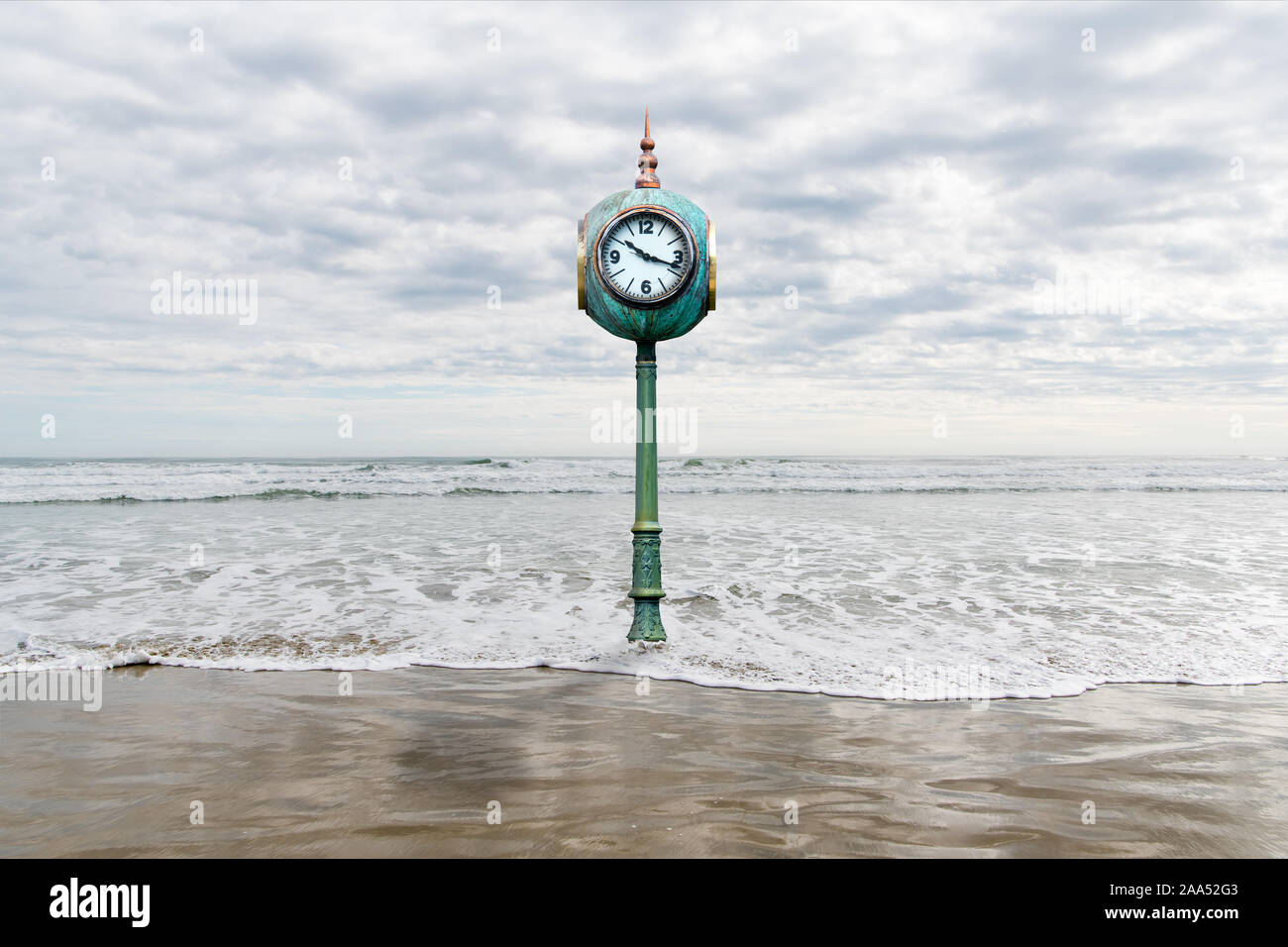 Vintage copper pedestal clock in rising waters of the sea illustrating ...