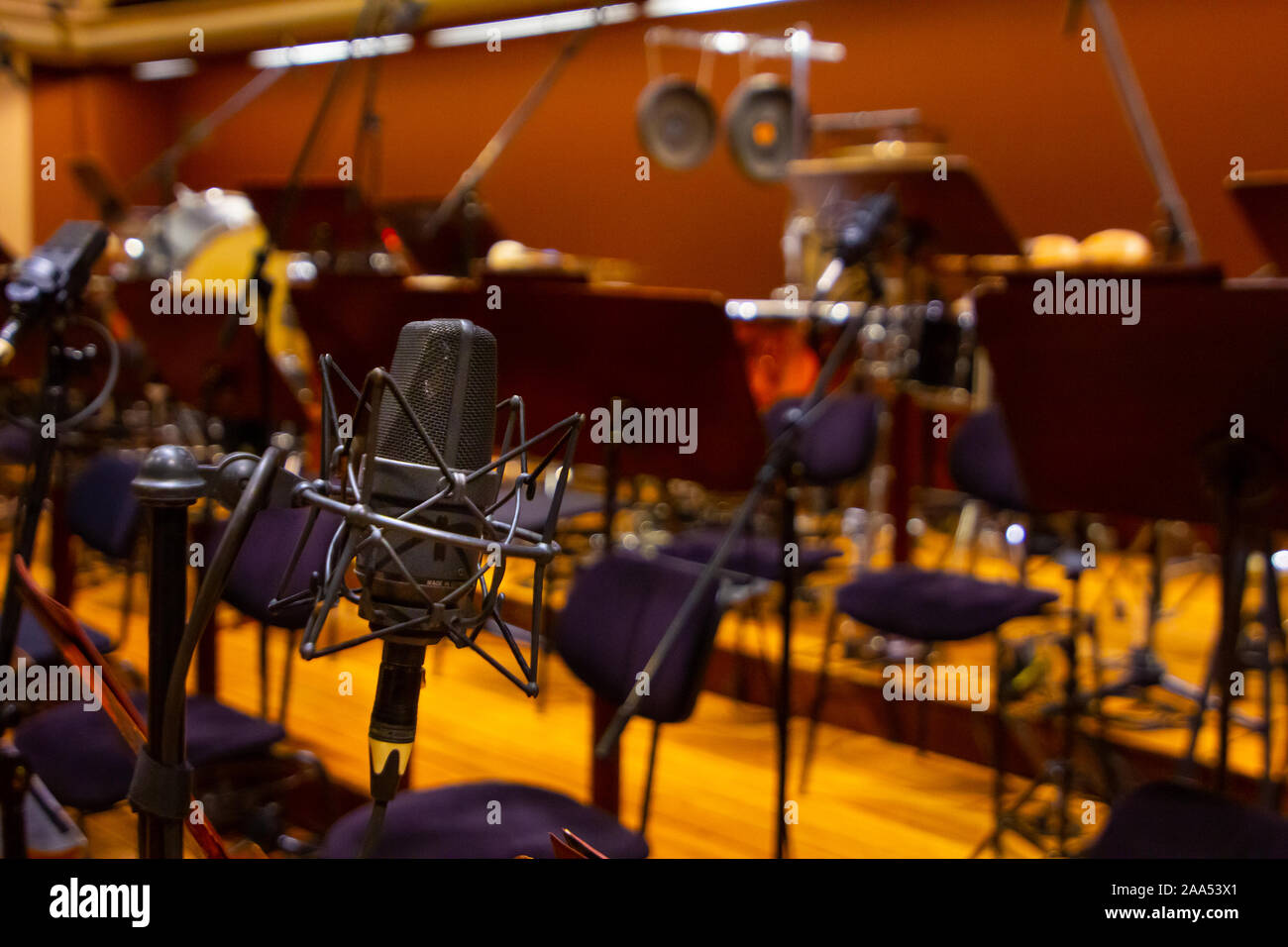 Microphone with a stand close up. Instruments of the Orchestra in ...