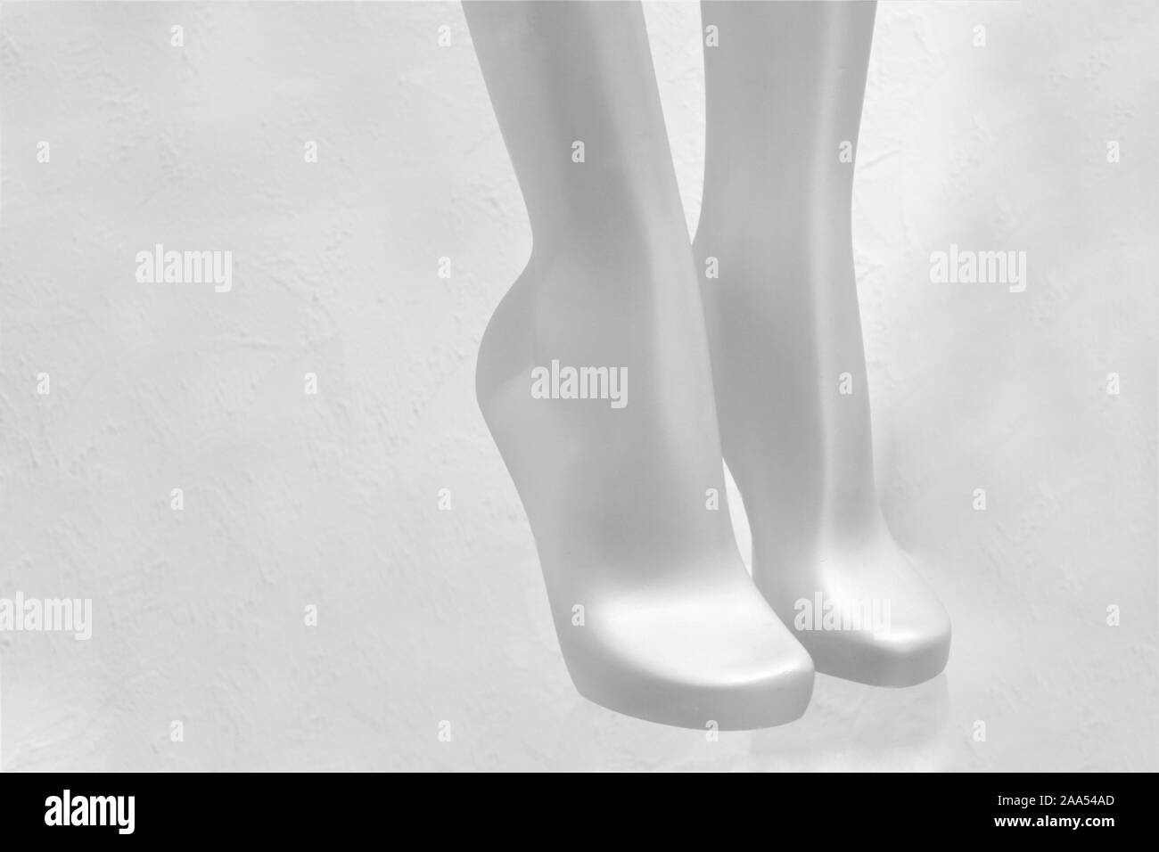 silver mannequin legs. showroom Stock Photo - Alamy