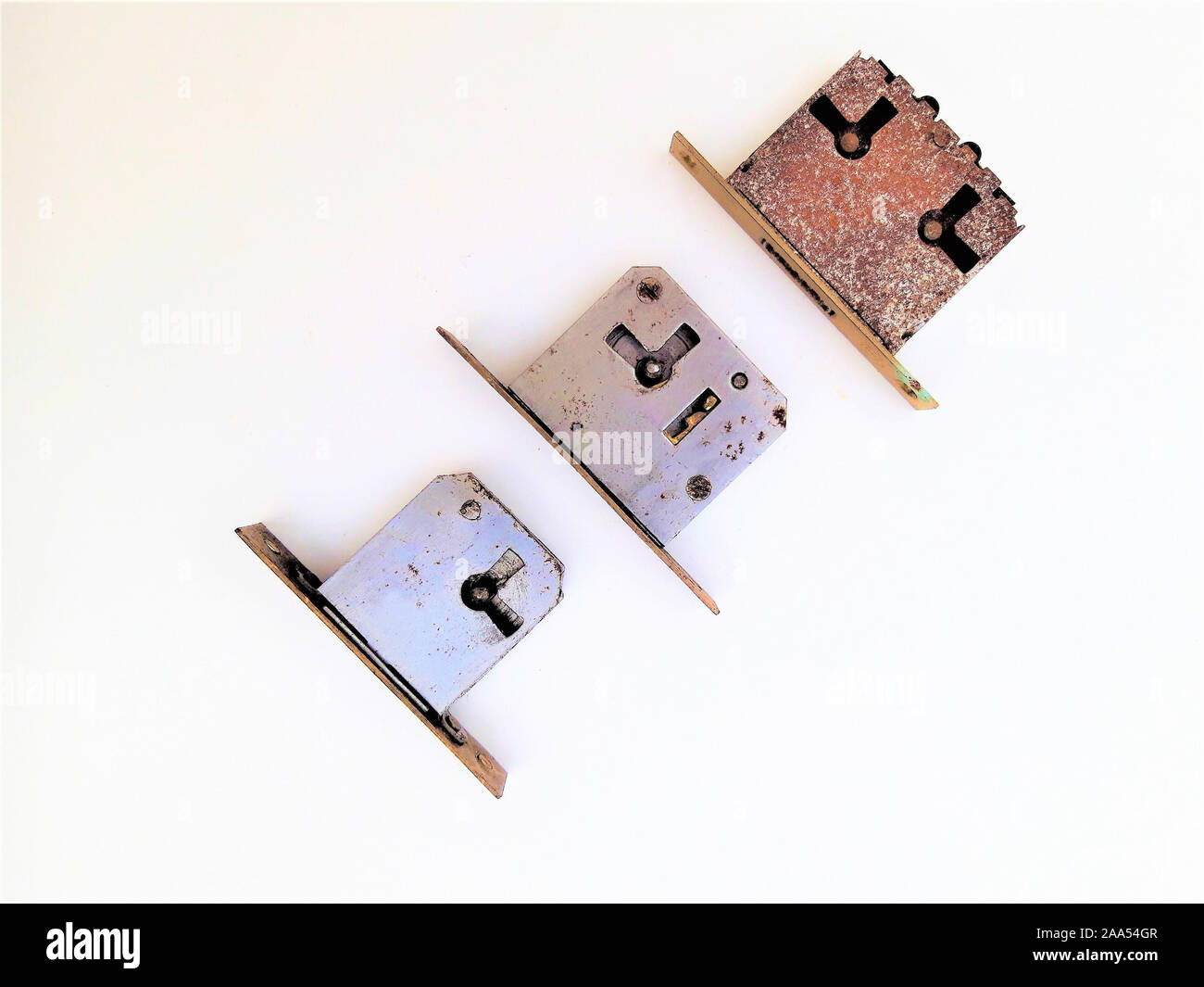 Three rusty locks on white background Stock Photo - Alamy