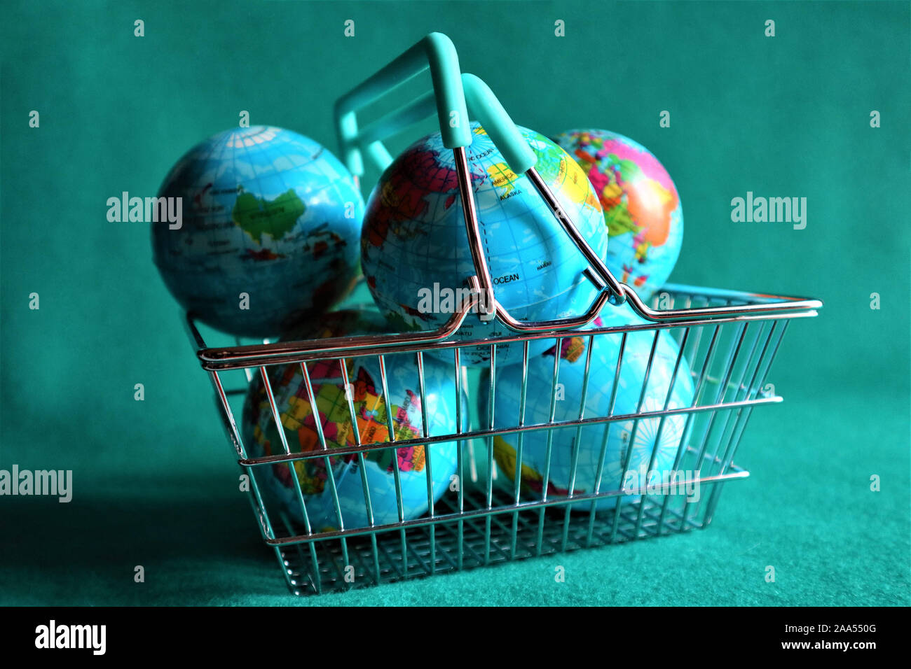 Earth globe in shopping cart. How many Earths do we need Stock Photo ...