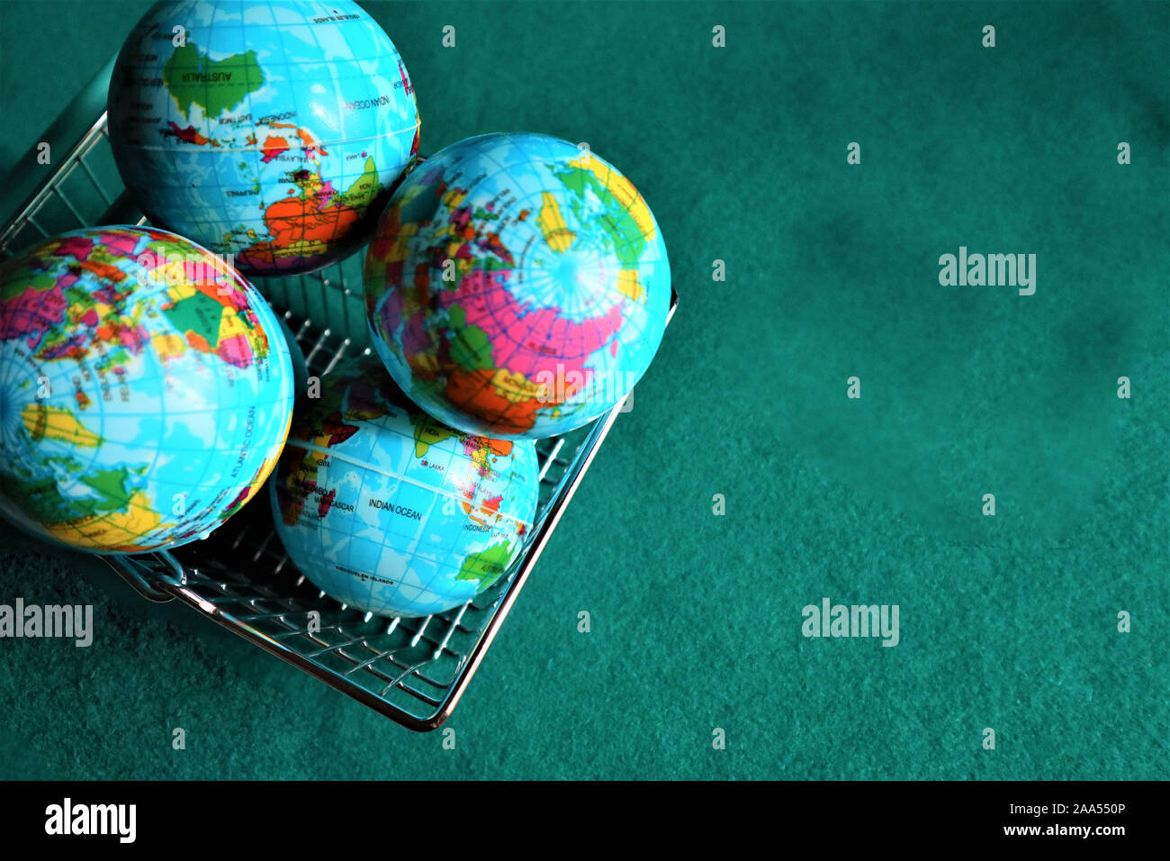 Earth globe in shopping cart. How many Earths do we need Stock Photo ...