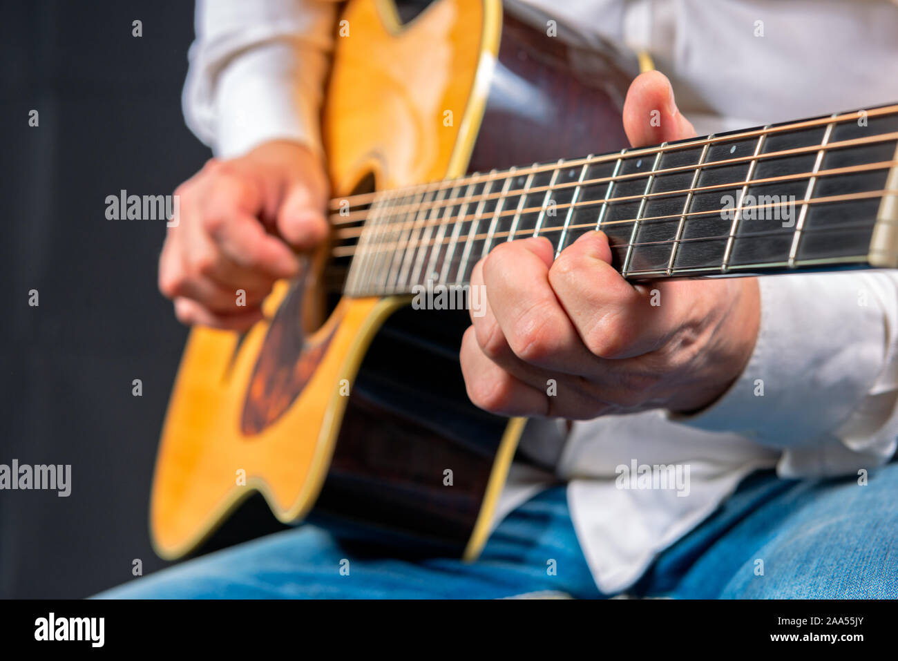 Mans hand playing acoustic guitar hi-res stock photography and images ...