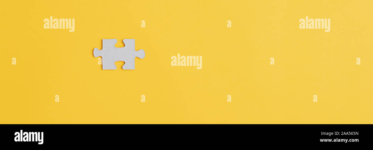 One blank puzzle piece place on yellow background. With plenty of copy ...