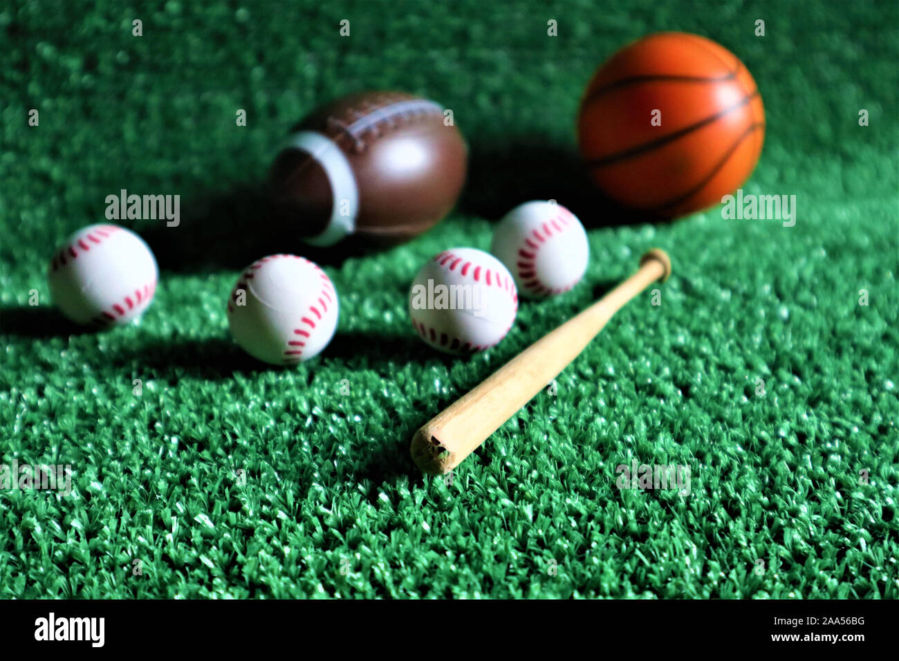 Sports accessories. sticks, balls on Green background. Sport game ...