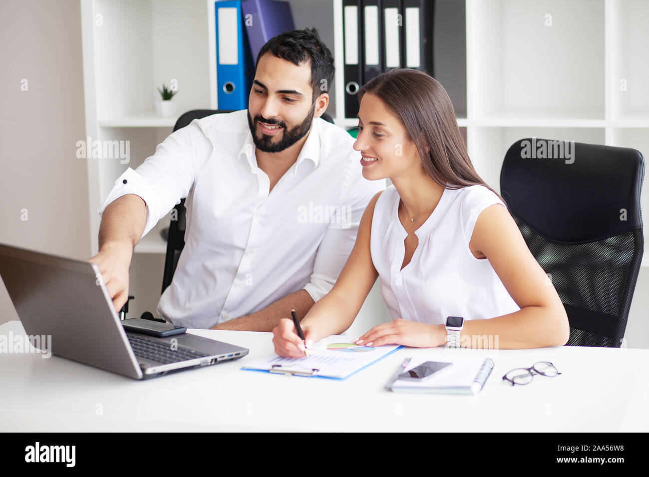 Side view portrait of man and woman armwrestling, exerting pressure on ...