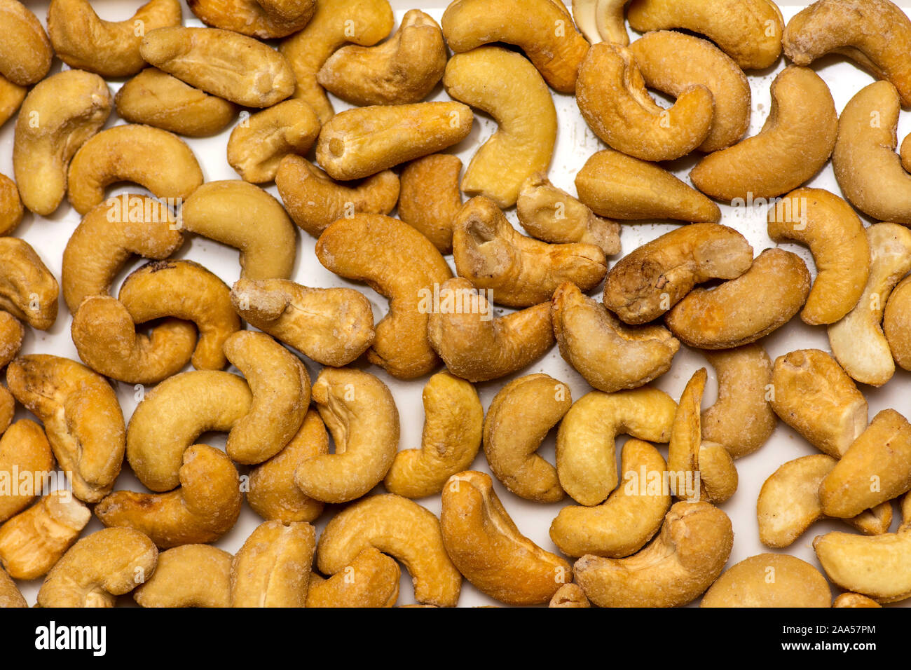 Salted Cashew nuts forming a background pattern Stock Photo - Alamy