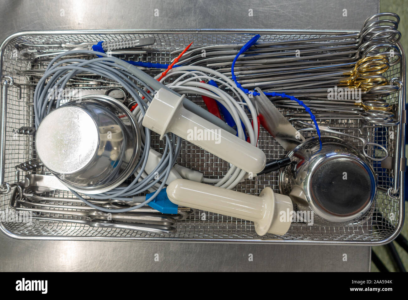 a tray for surgical instruments contains various assorted instruments ...