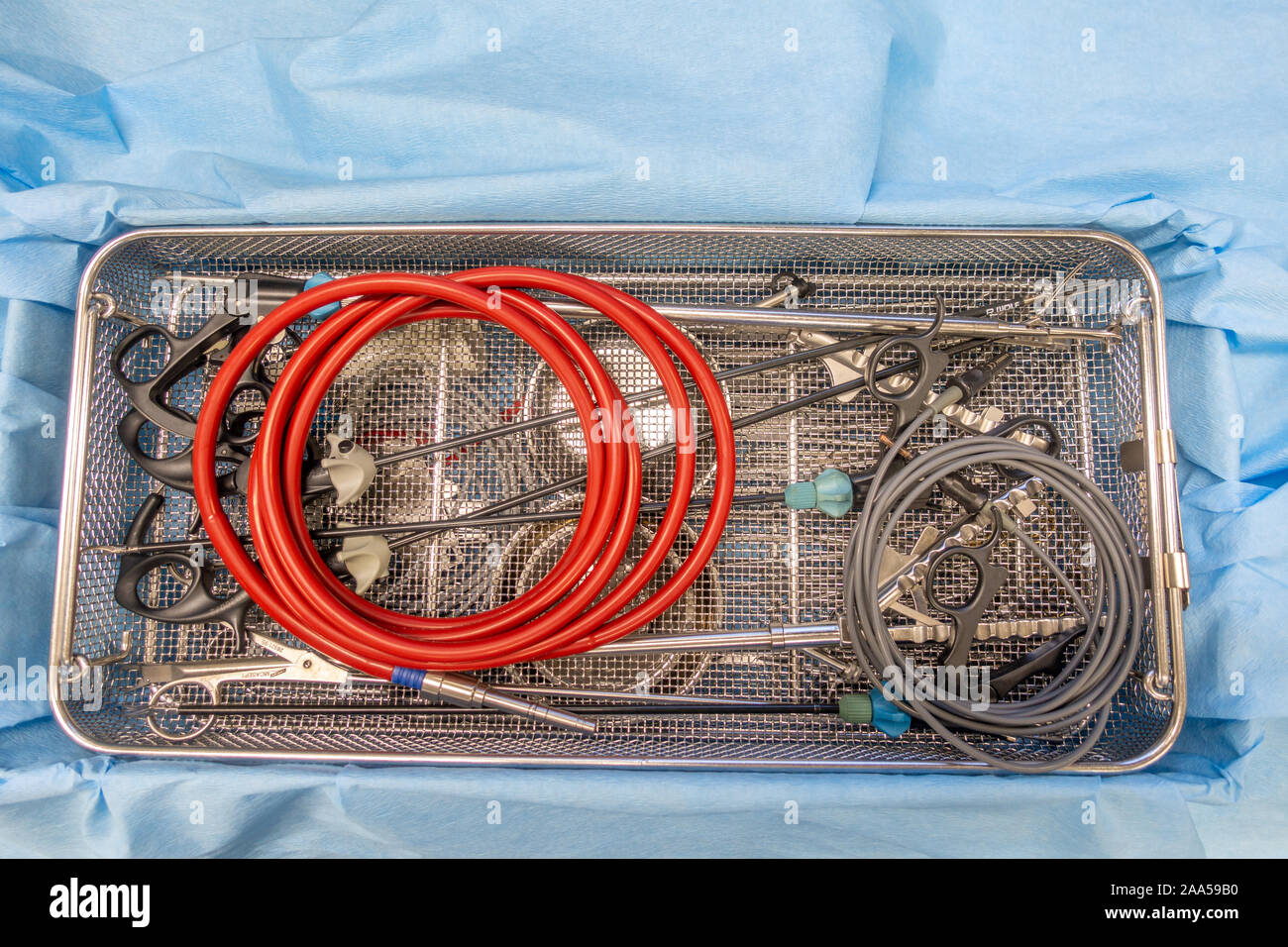 a tray for surgical instruments contains various assorted instruments ...