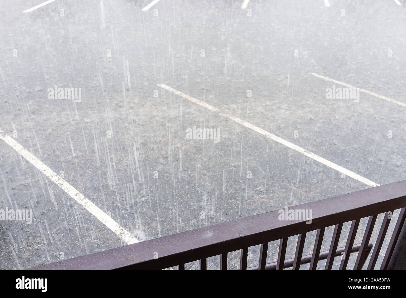 Rainy weather storm in apartment condo complex with rain water falling ...