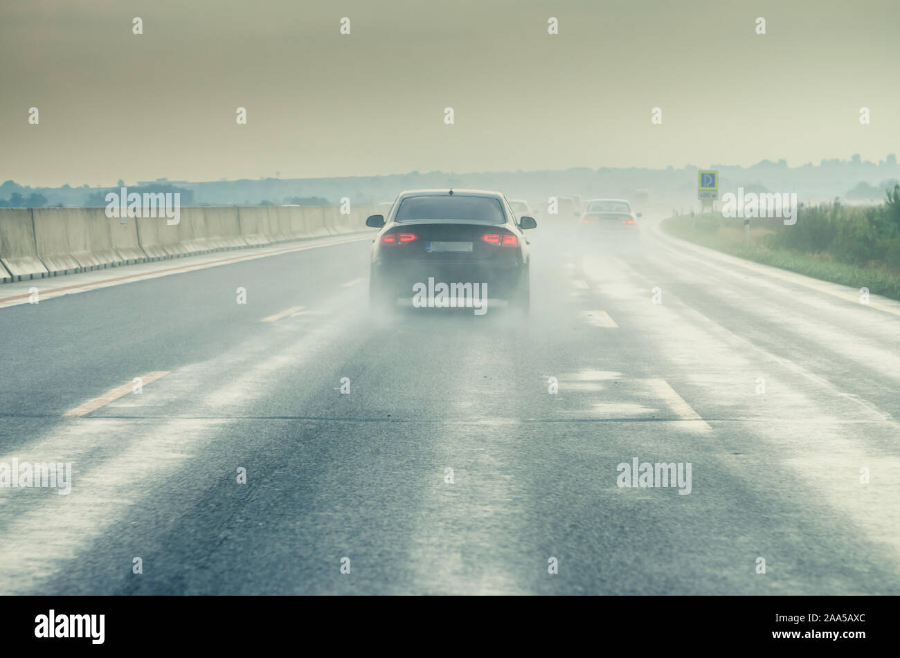 traffic in slippery and wet highway road in dangerous stormy and rainy ...