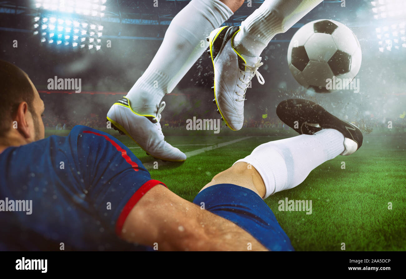 Football scene at night match with close up of two soccer players ...