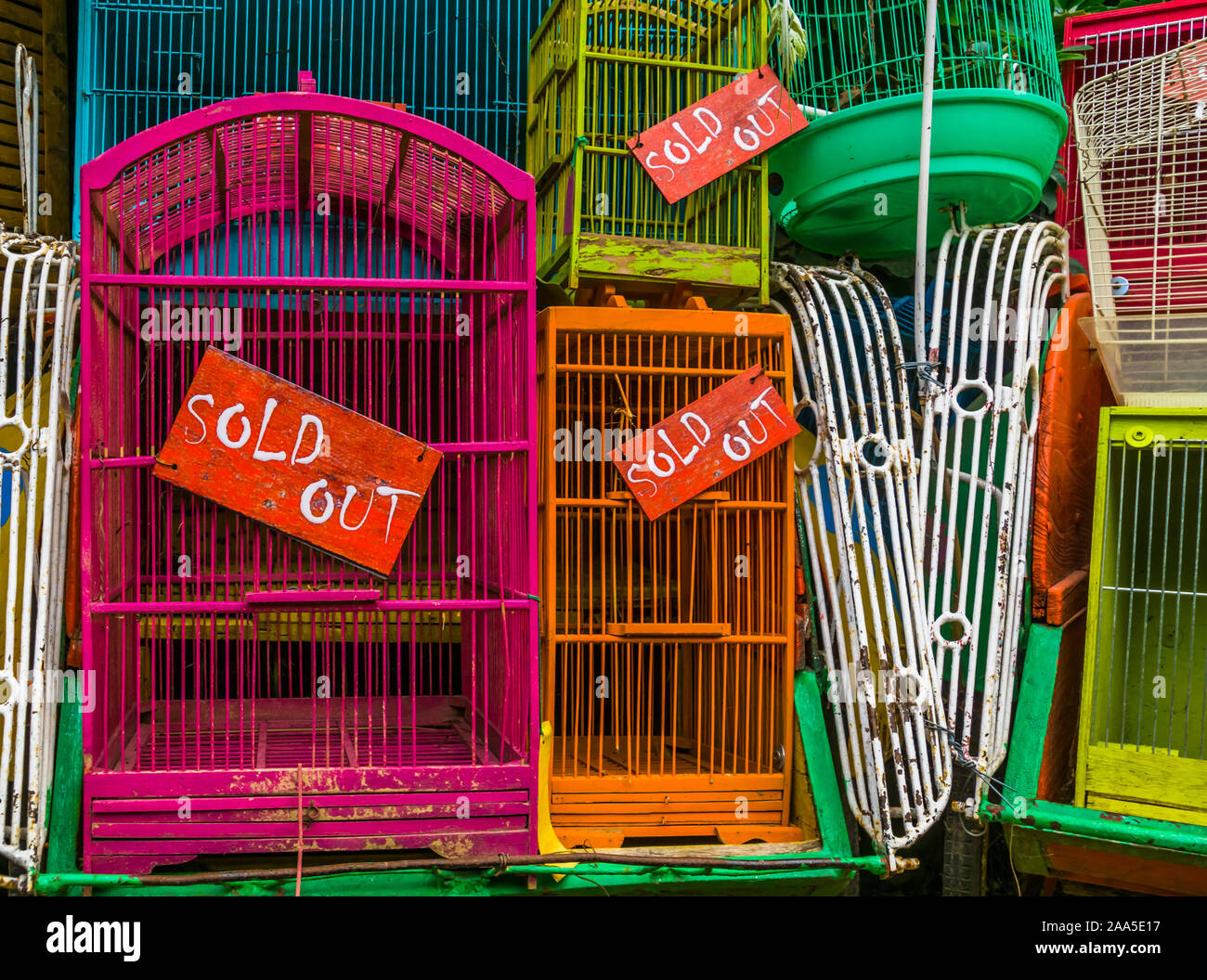 bird cages with sold out signs in closeup, Pet trade in Asia, Animal ...