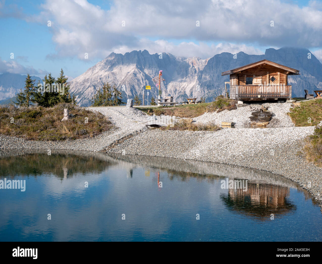 Image of mountain landscape with water reflection and little hut Stock ...