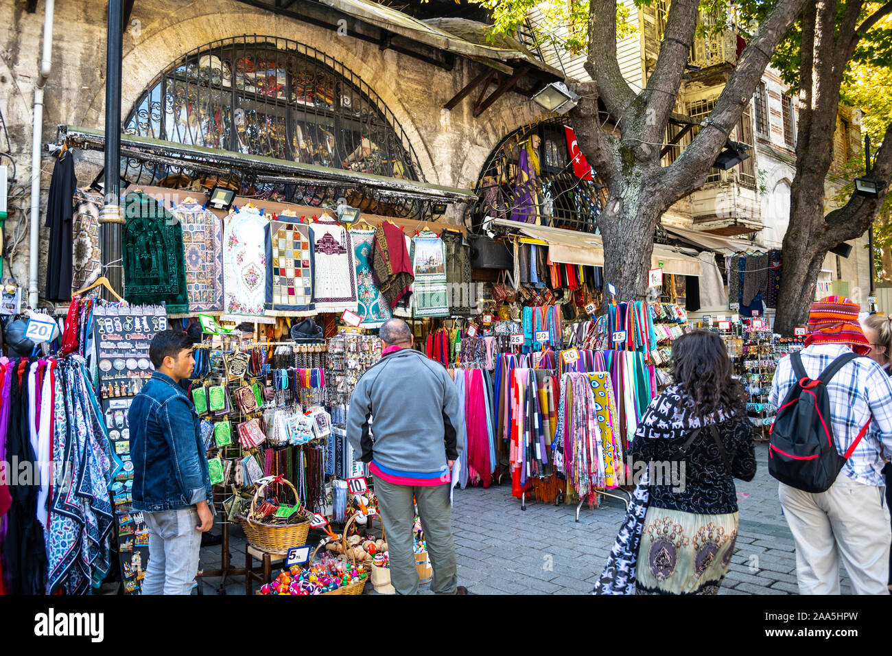 Turkish merchants wait for customers at an outdoor souvenir market ...