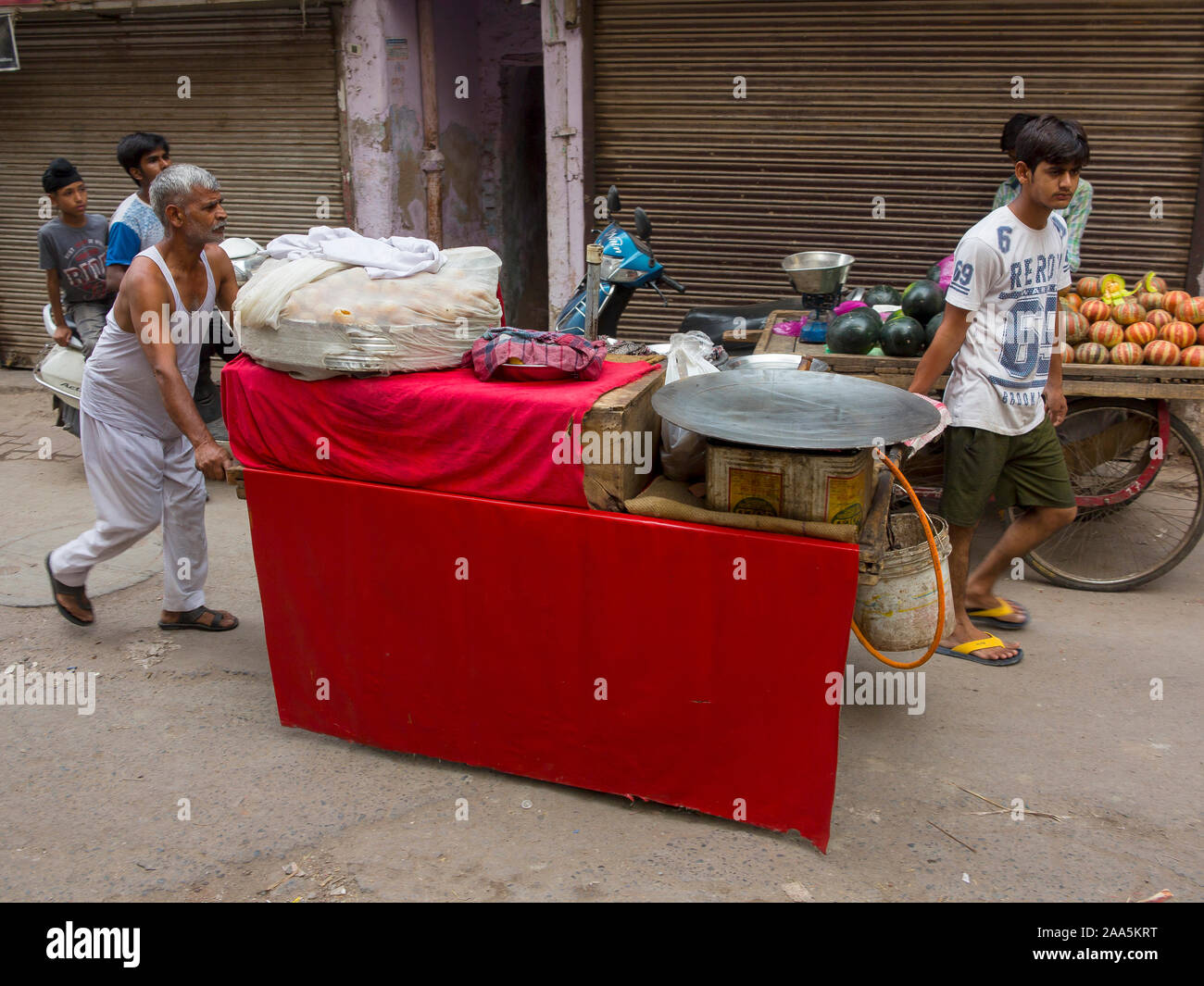 Indian old man moving his mobile restaurant at Sangatrashan Bazar, New ...