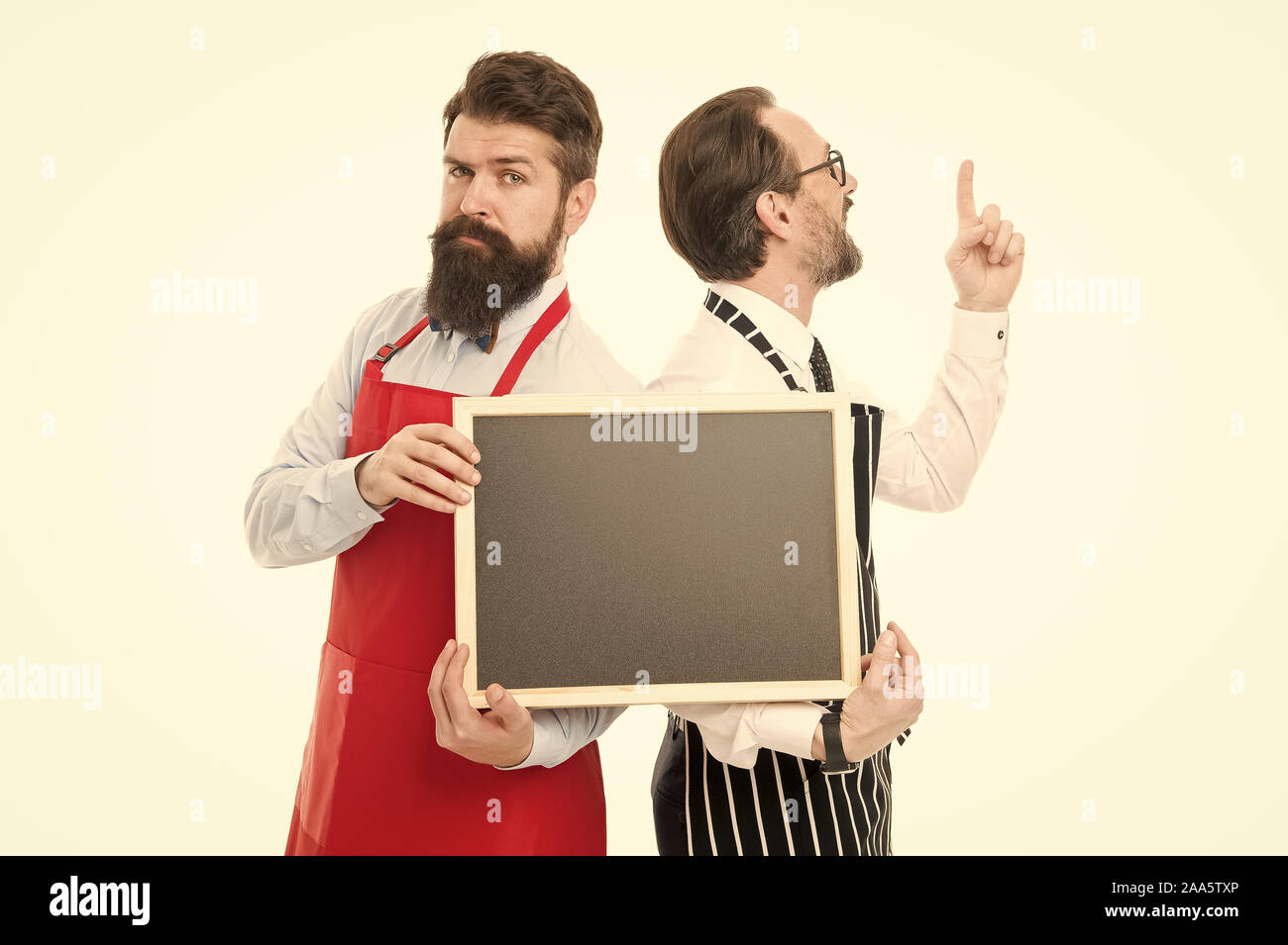 Men bearded bartender in apron hold blank chalkboard. Bartender with ...