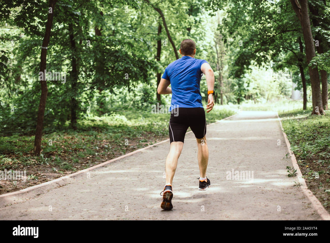 Young happy man running hi-res stock photography and images - Alamy