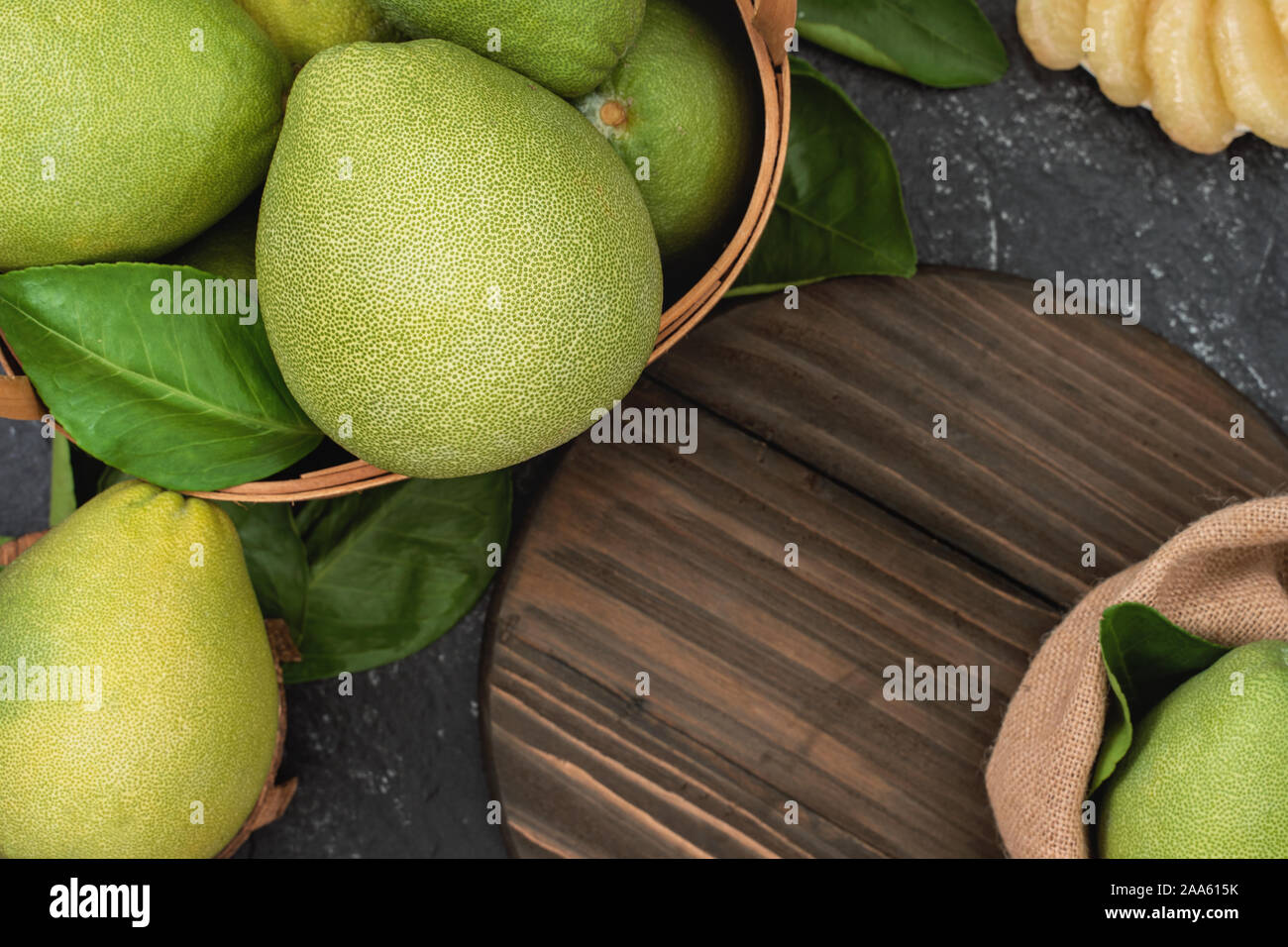 Fresh peeled pomelo, pummelo, grapefruit, shaddock on dark background ...