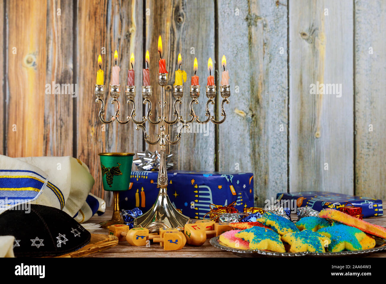 Closeup of a burning Chanukah candlestick with candles Menorah a ...
