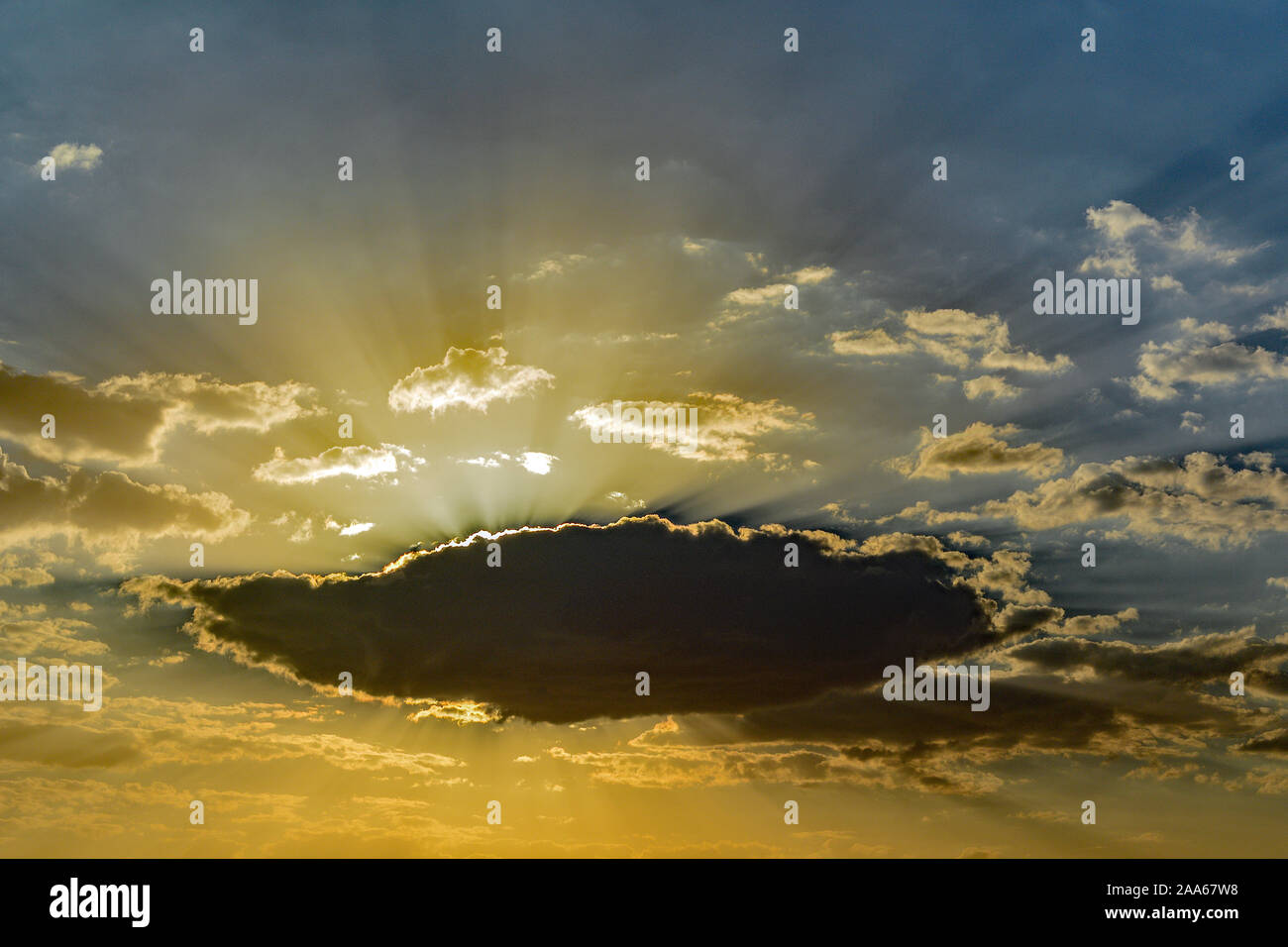 Sun behind clouds in Bahrain Stock Photo - Alamy