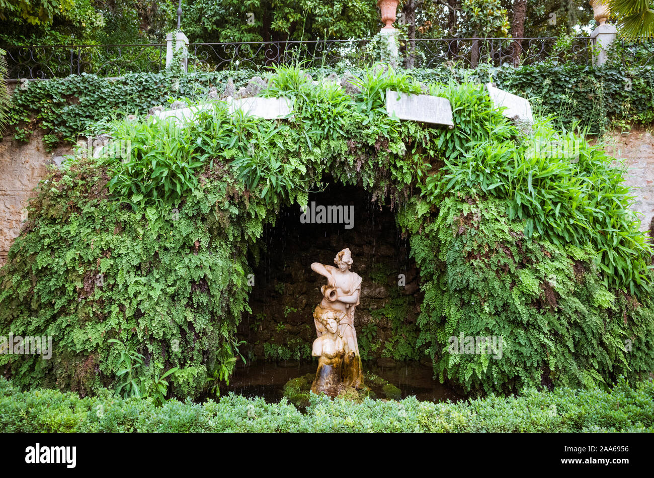 Granada, Spain : Baroque female statue in a grotto at the entrance of ...
