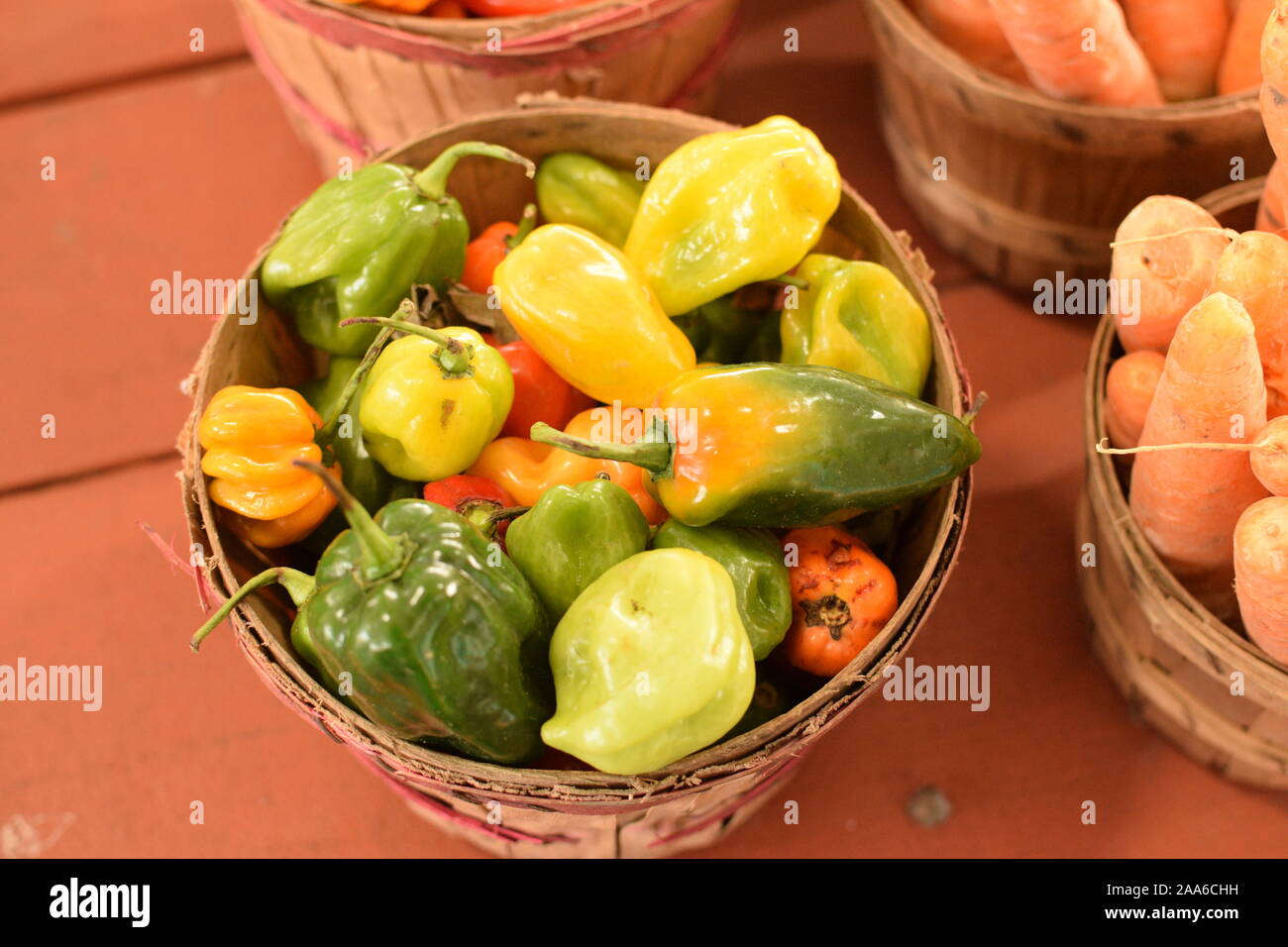 hot peppers in basket at farmers market Stock Photo - Alamy