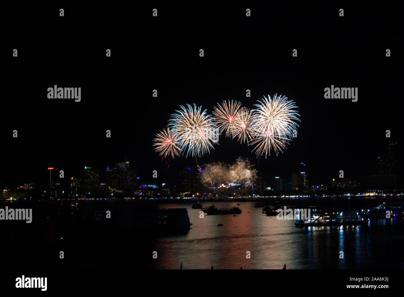 Pattaya city thailand fireworks on beach and reflection color on water ...