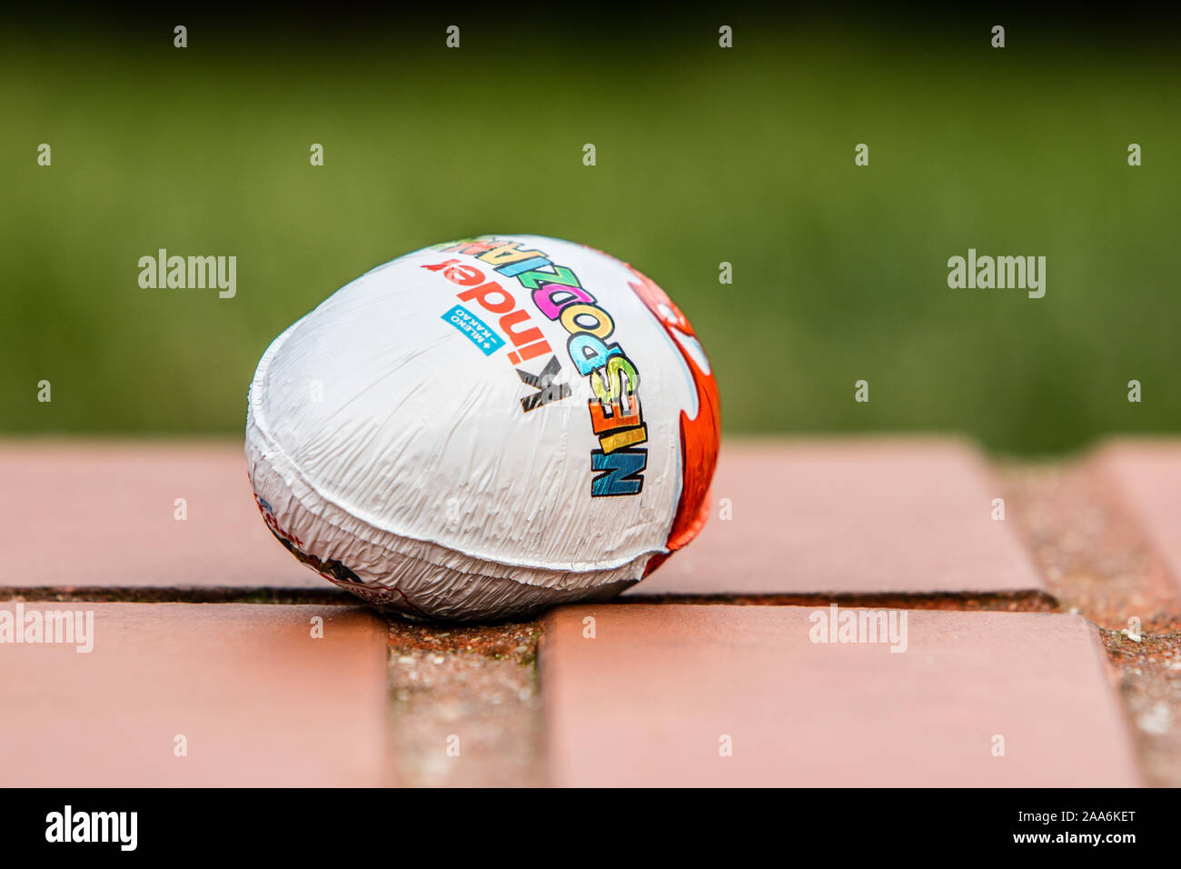 Kinder Surprise egg consists of a chocolate shell, plastic capsule with ...