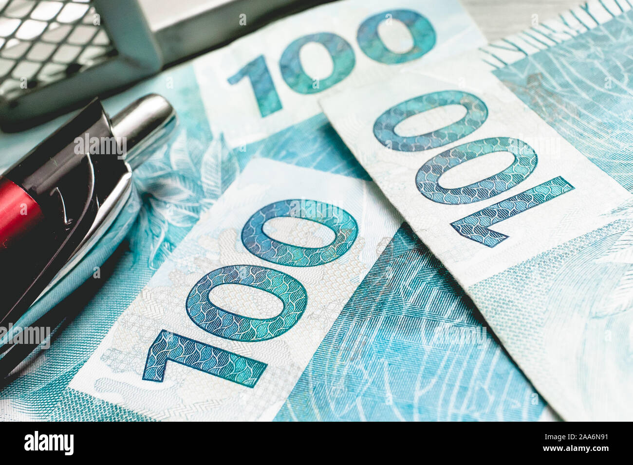 Real - Brazilian Currency. Some 100 reais bills on a table Stock Photo ...