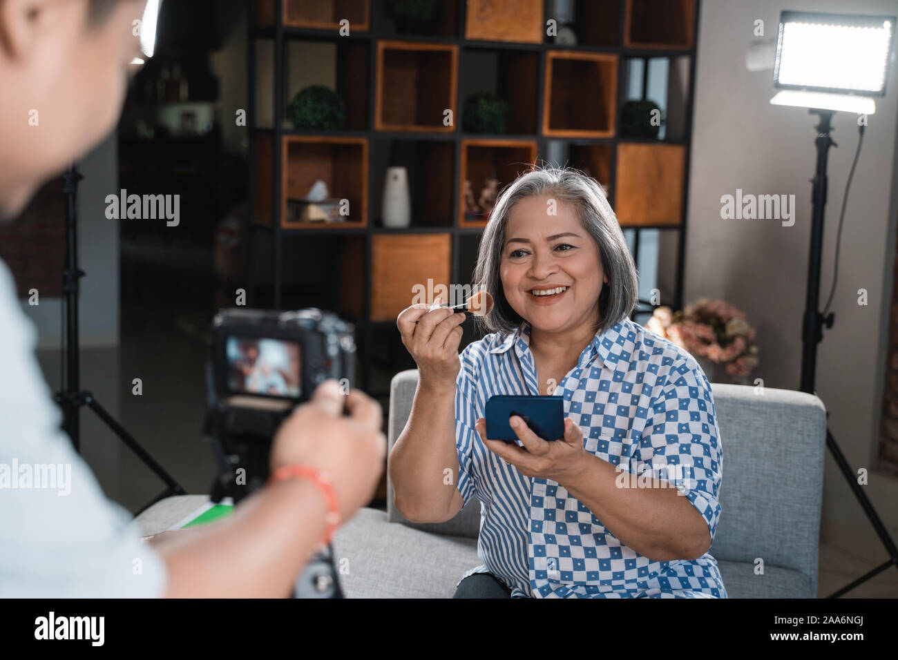 Old women making a video for her blog on cosmetics Stock Photo - Alamy