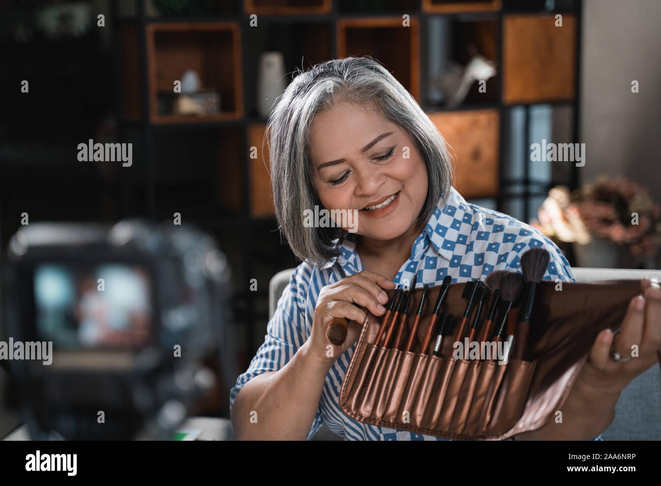 Old women making a video for her blog on cosmetics Stock Photo - Alamy