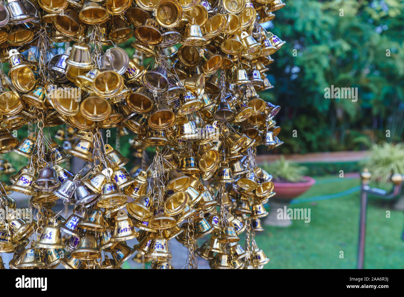 Copper bells hung together in Thai temple Stock Photo - Alamy