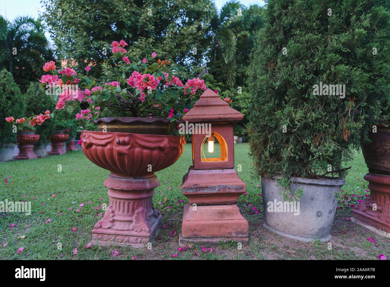 Red stone lantern and flower pot Stock Photo - Alamy