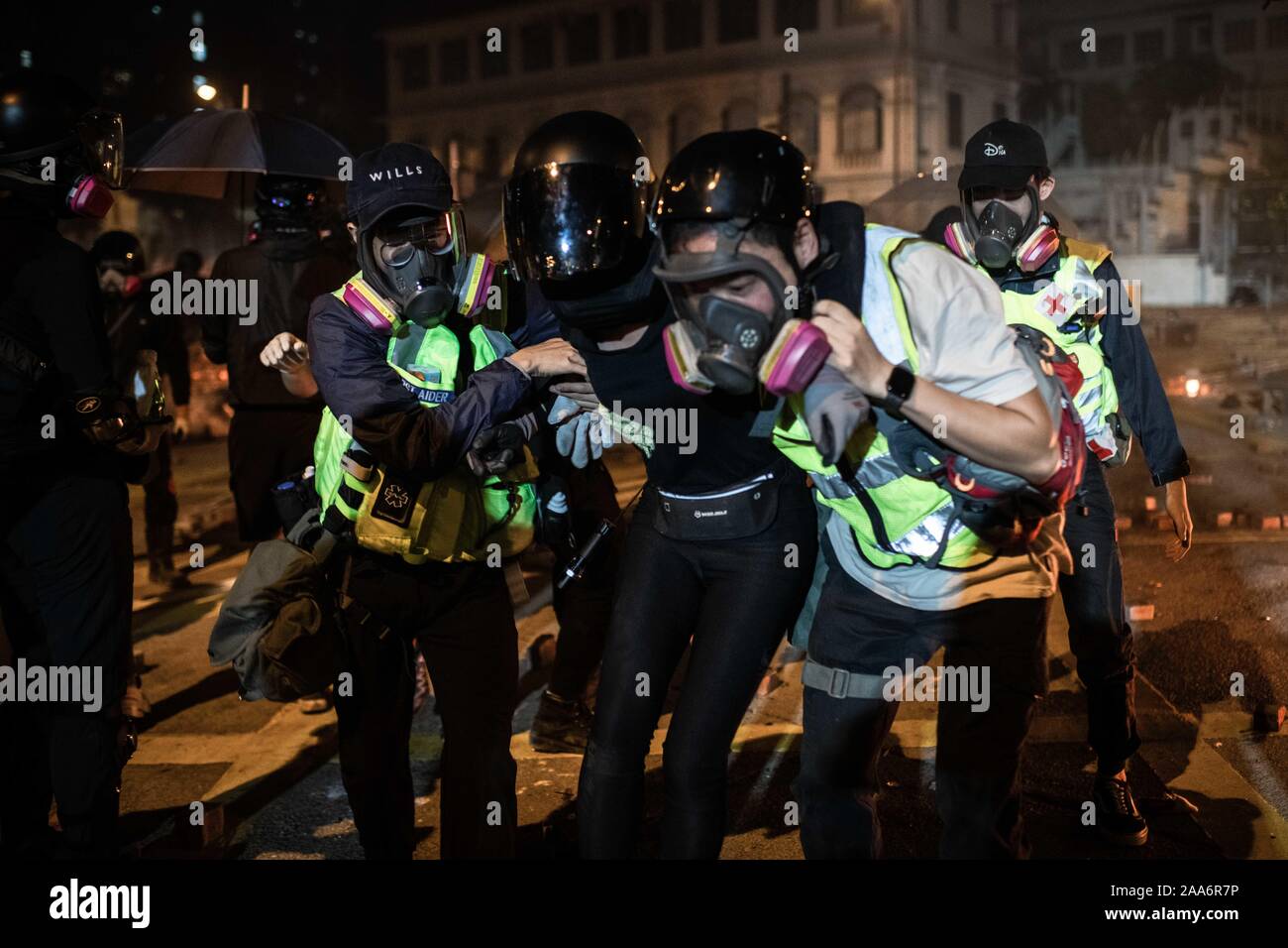 Hong Kong, China. 16th Nov, 2019. First aiders help to carry a wounded ...