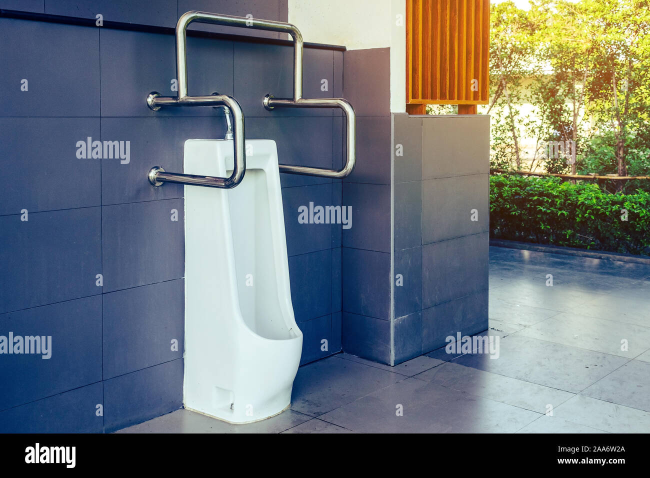 Clean and modern public men toilet with friendly design for people with ...