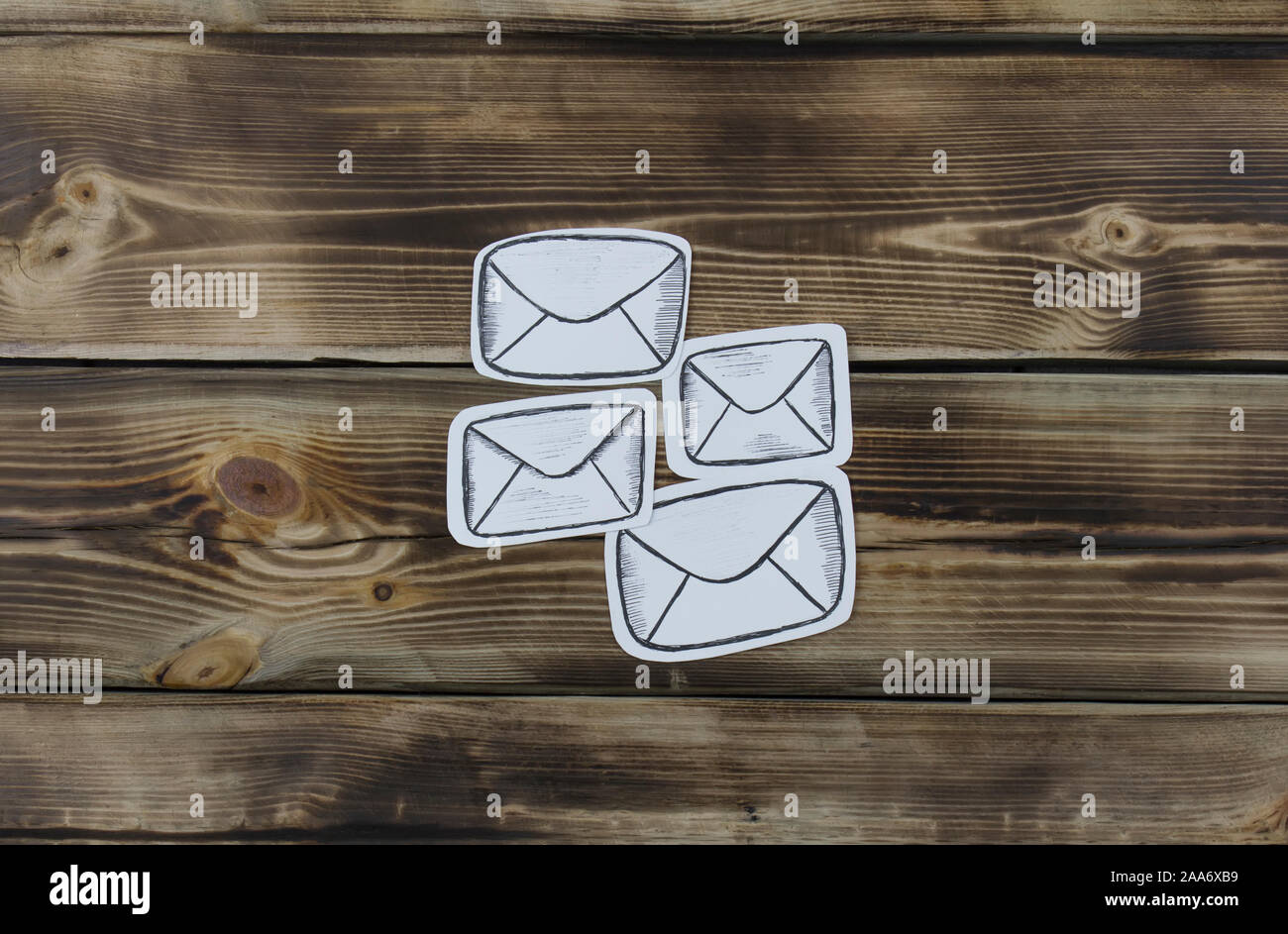 Paper sketched drawing with mail-themed letters on wooden Stock Photo ...