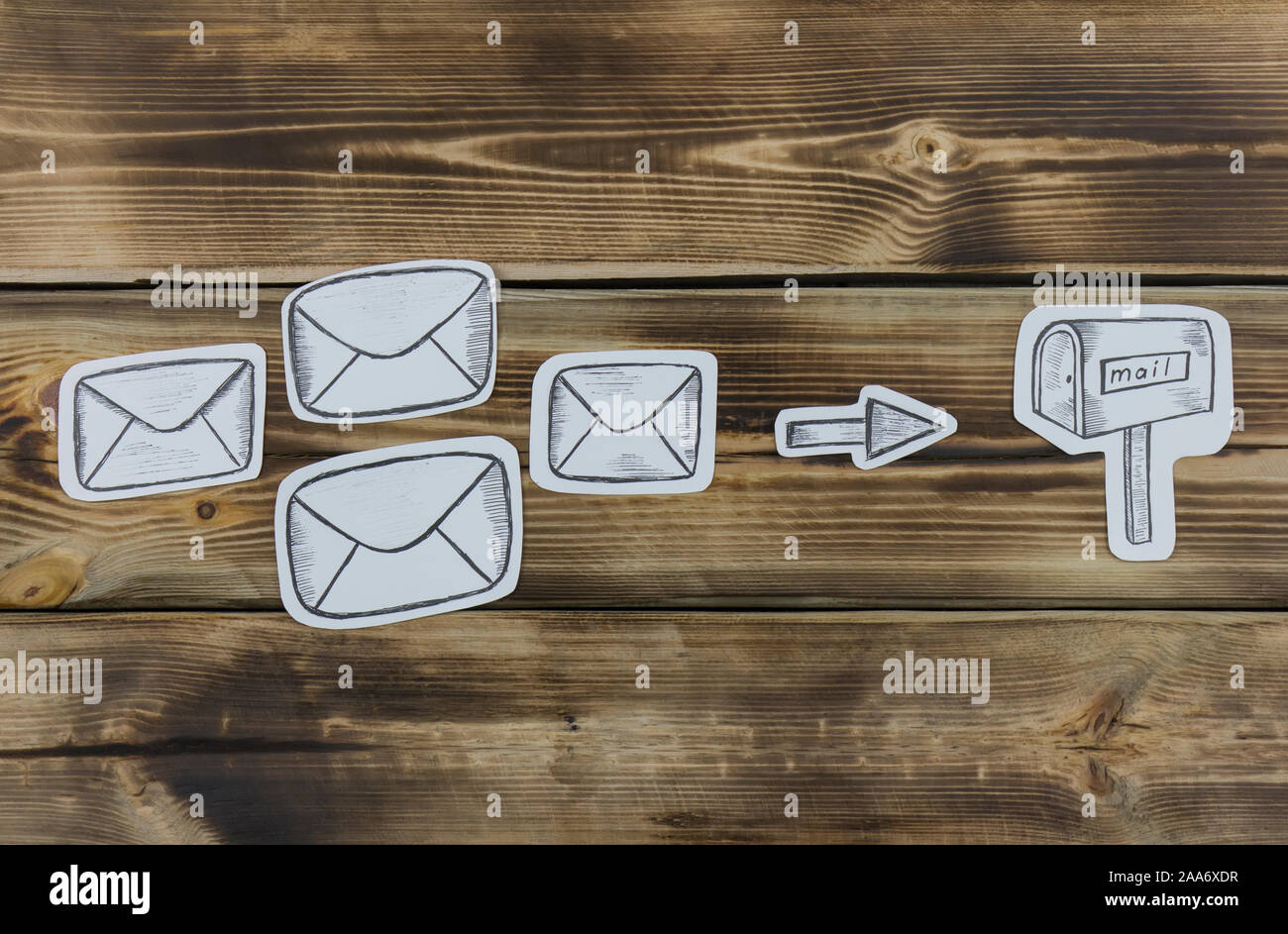 Paper sketched sketches with mail-themed letters on wooden Stock Photo ...