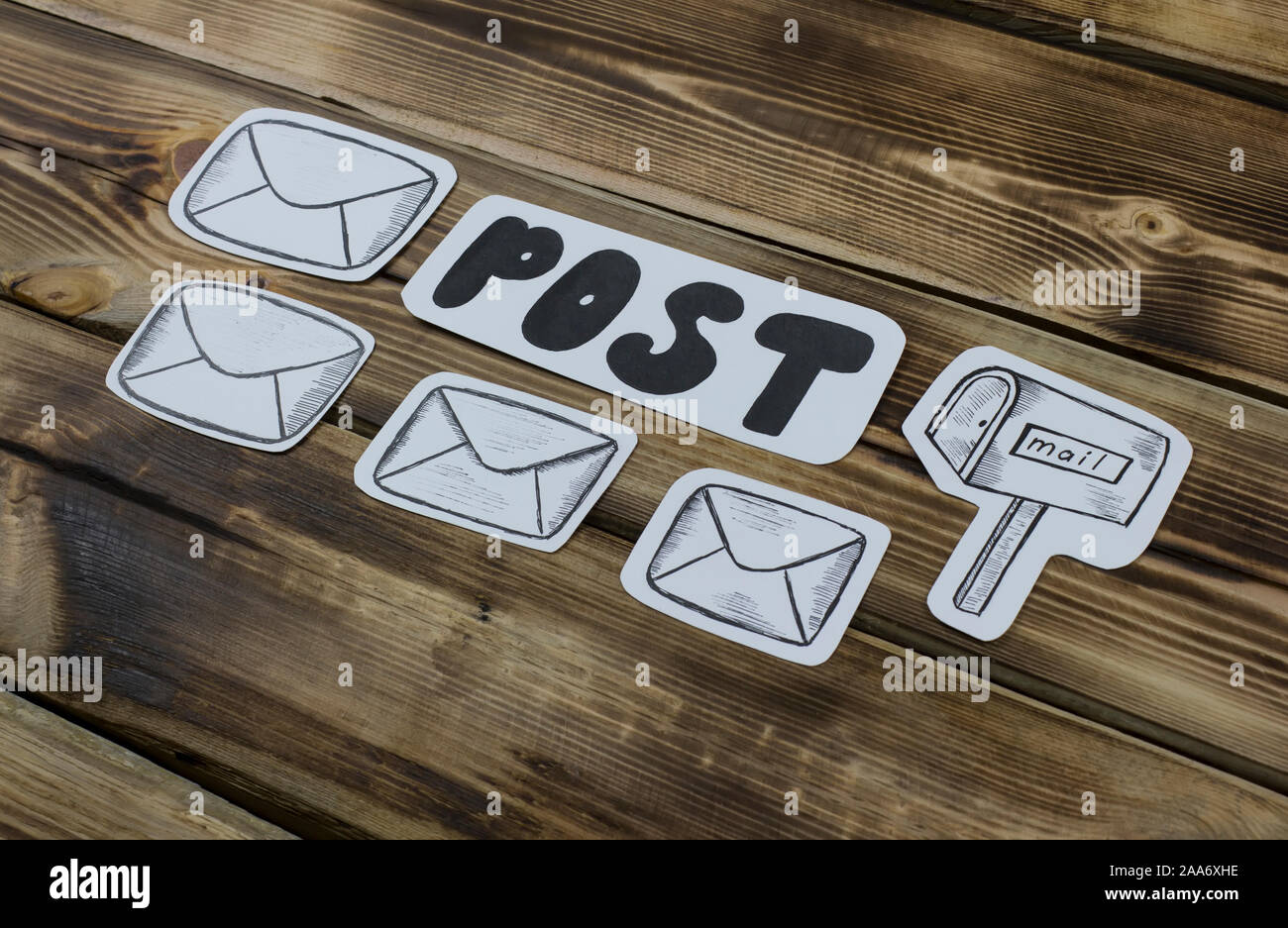 Paper sketched sketches with mail-themed letters on wooden Stock Photo ...