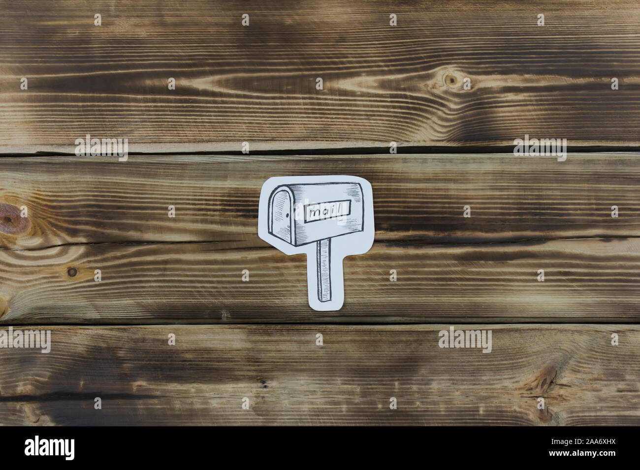 Paper sketch mailbox on natural wooden background Stock Photo - Alamy