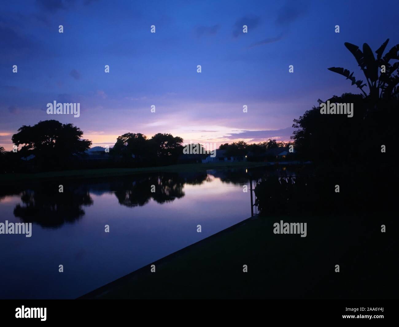 purple sunset in back yard Stock Photo - Alamy