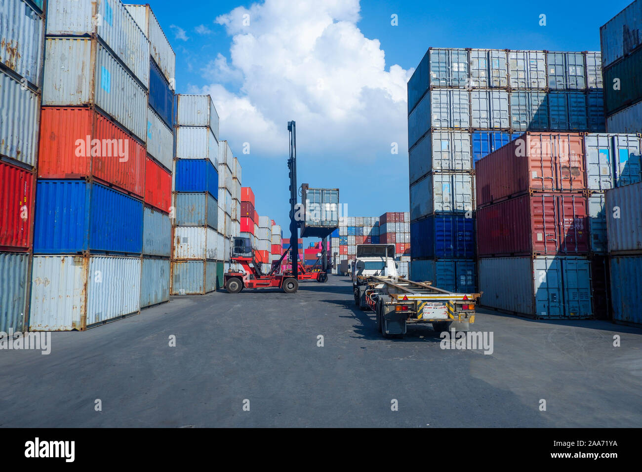 Container handlers In the shipping dock with storage cabinet background ...