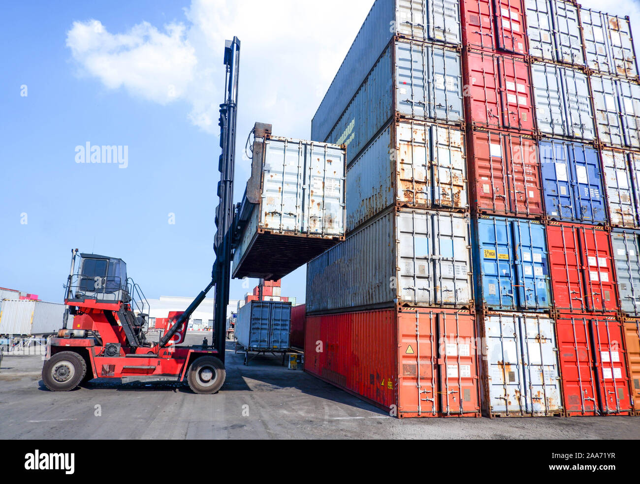 Container handlers In the shipping dock with storage cabinet background ...